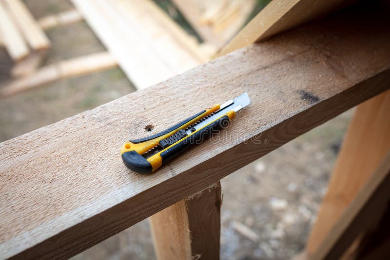 A Construction Knife in the Hand of a Worker Stock Image - Image of ...
