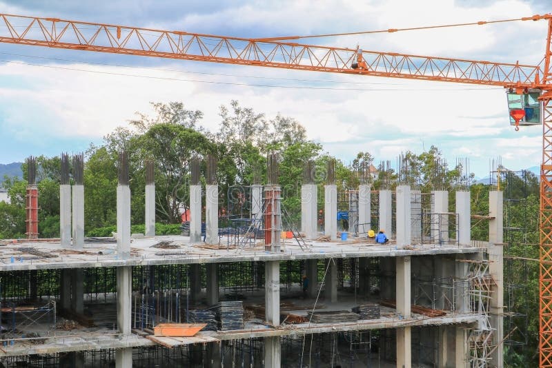 Construction Laborer Team Working and Crane on High Ground Building ...
