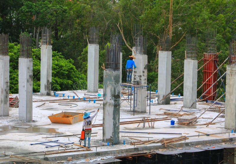 Construction Laborer Team Working on High Ground Building Commercial in ...