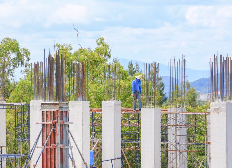 Construction Laborer Team Working on High Ground Building Housing in ...