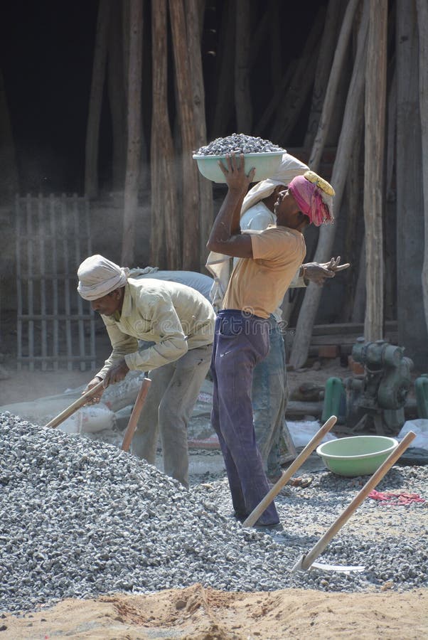 Construction Labour Working at Construction Site Carrying Brick Cement ...