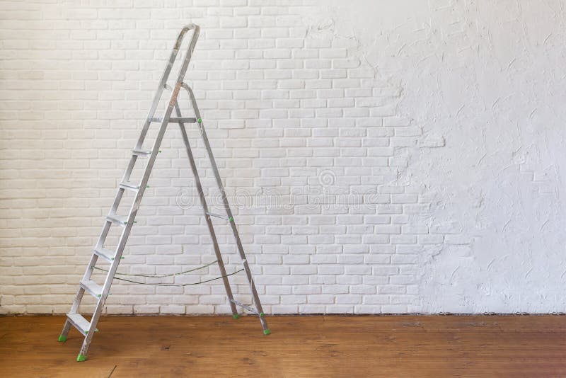 A Construction Ladder Stands on a Wooden Floor. Stock Image - Image of ...