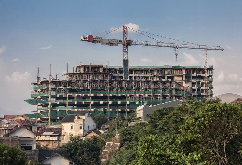 Apartment Under Construction with Heavy Equipment Stock Photo - Image ...