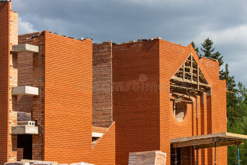 Construction of a Large Red Brick Catholic Church. High, Even Walls of ...