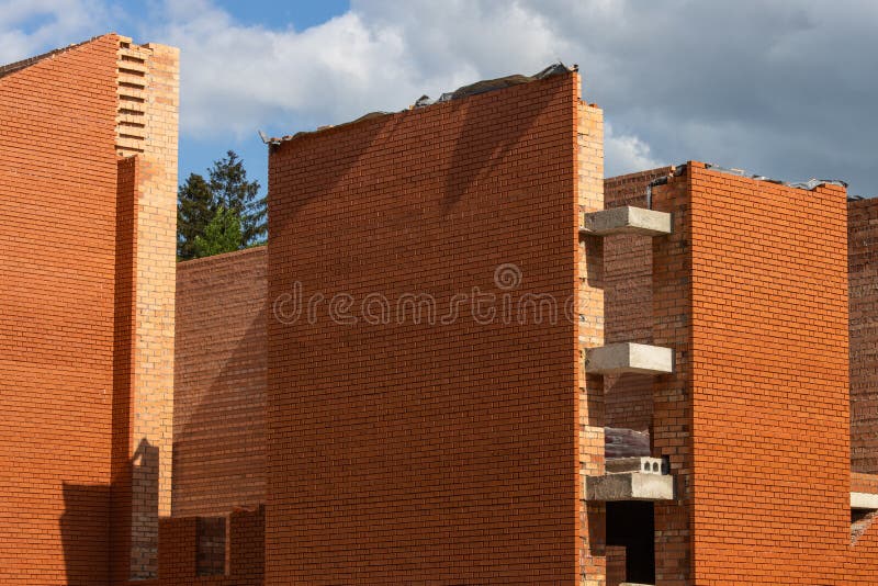 Construction of a Large Red Brick Catholic Church. High, Even Walls of ...