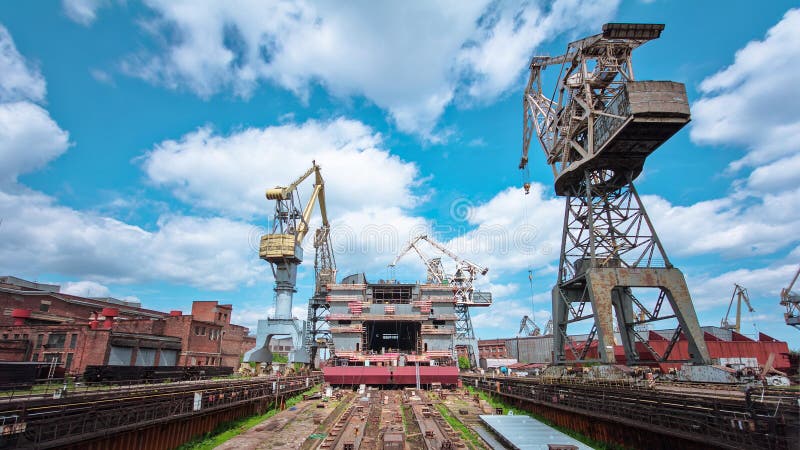 The Construction of a Large Ship on a Shipyard with Cranes Timelapse ...