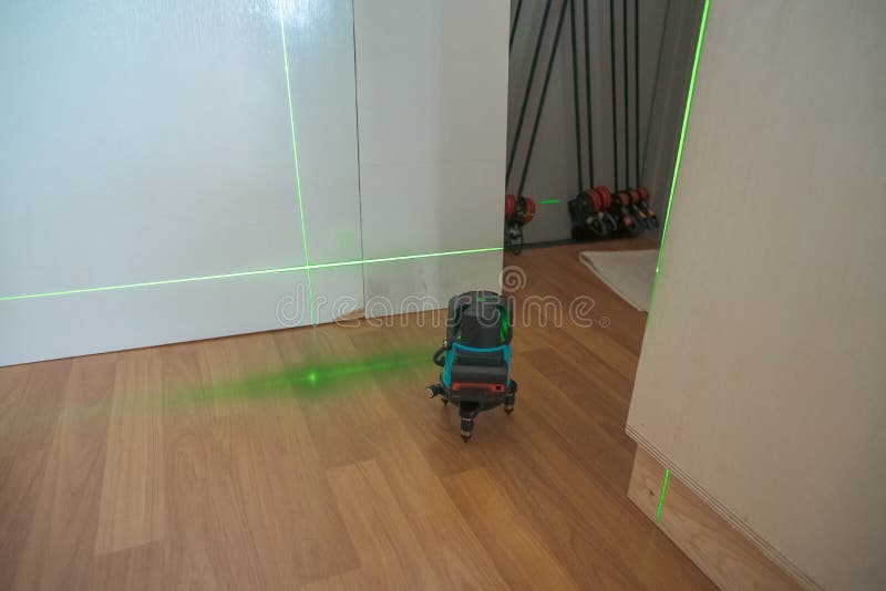 Construction Laser Level on the Floor. Apartment Renovation and ...