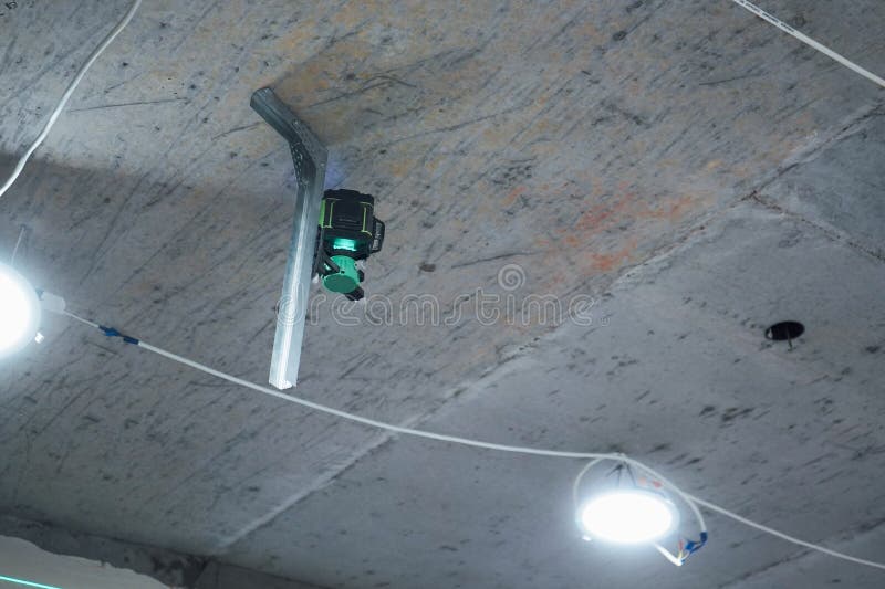 Construction Laser Level in a House Under Construction. Laser Equipment ...