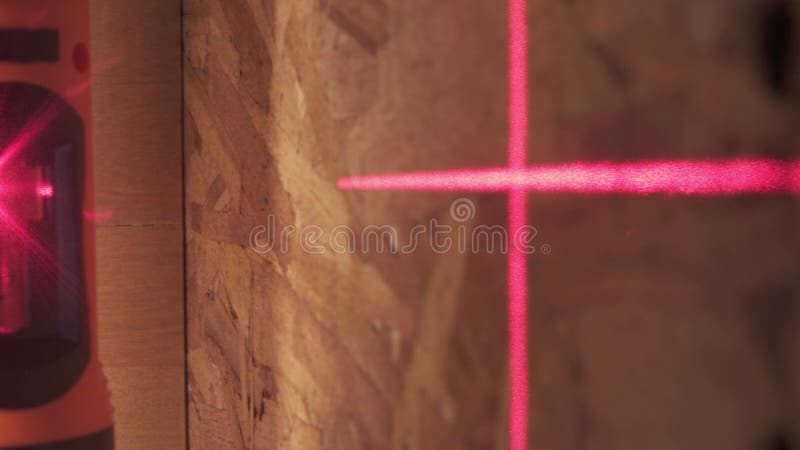 Construction Laser Level and Red Lines of a Marking on a Wall Surface ...