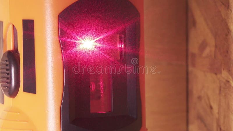 Construction Laser Level and Red Lines of a Marking on a Wall Surface ...