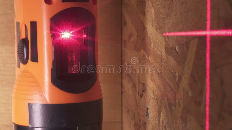Construction Laser Level and Red Lines of a Marking on a Wall Surface ...