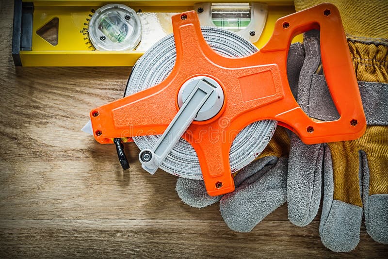 Construction Level Protective Gloves Measuring Tape on Wooden Bo Stock ...