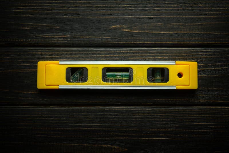 Construction Level on Vintage Dark Boards. Low Key Concept of ...