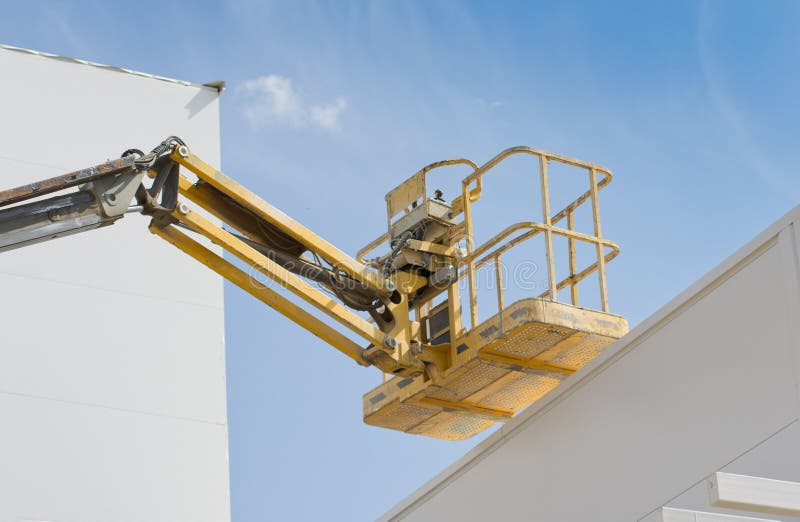 Builder on a Scissor Lift Platform at a Construction Site Stock Image ...