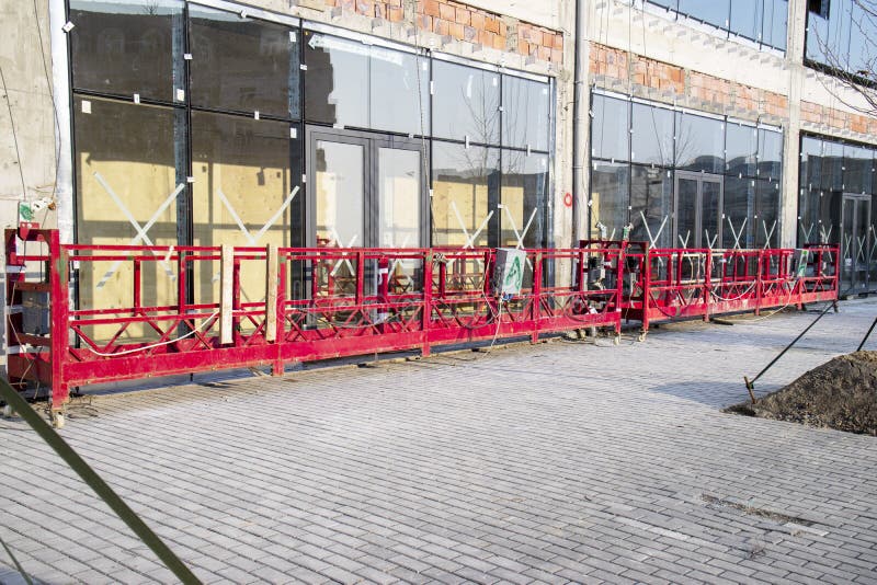 Construction Lift for Working on the Walls of the House. View of the ...