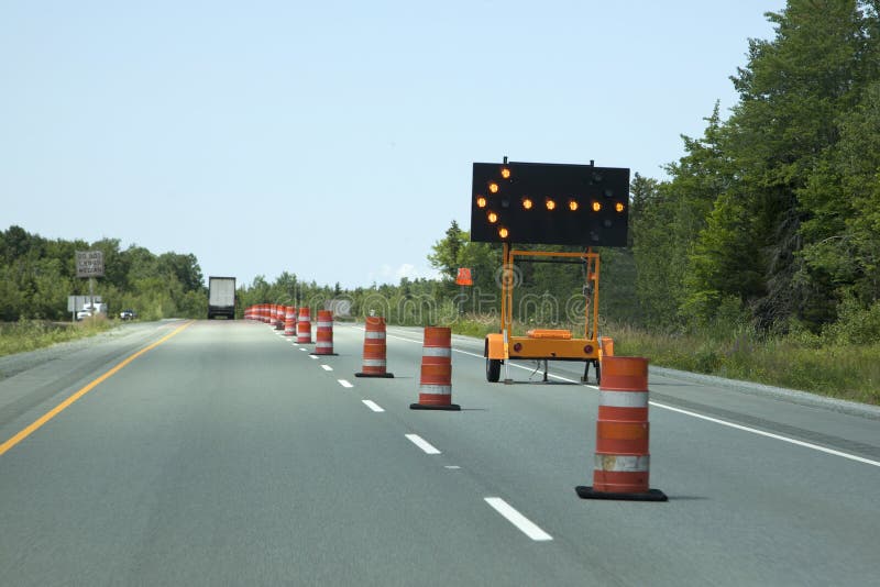Construction Lit Arrow on the Highway Stock Photo - Image of cones ...