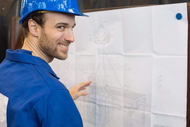 Construction Looking at Building Plan Stock Image - Image of occupation ...