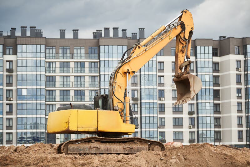 Construction Machine Excavator Standing in Front of Modern Apartment ...