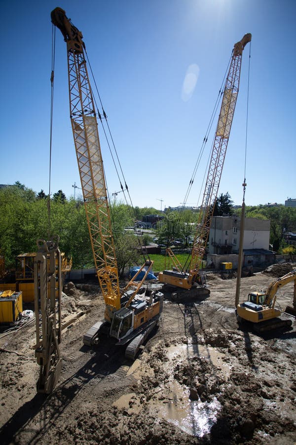 Construction Machinery Busy at Work in an Urban Site Setting within the ...
