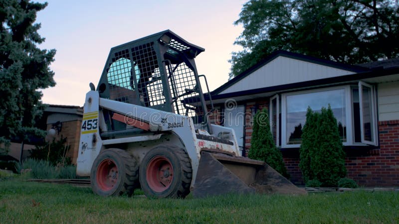 Construction Machinery on Front Lawn of Home Stock Footage - Video of ...