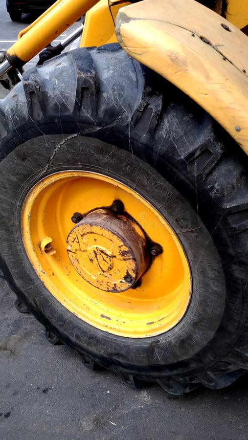 Construction Machinery Wheel Stock Photo - Image of grader, yellow ...