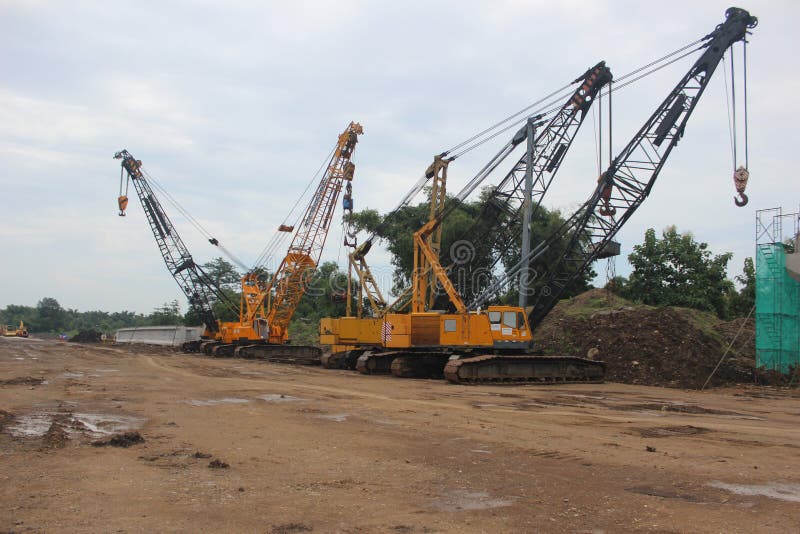 Crane Construction Machinery is Working on Road Projects and Building ...