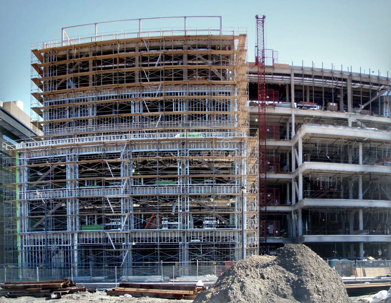 Construction Machines and People Works at High-rise Construction Site ...