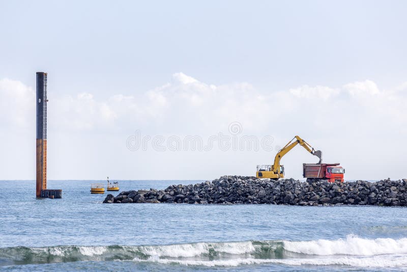 Construction Machines are Working To Build Pier and Harbor. Stock Photo ...