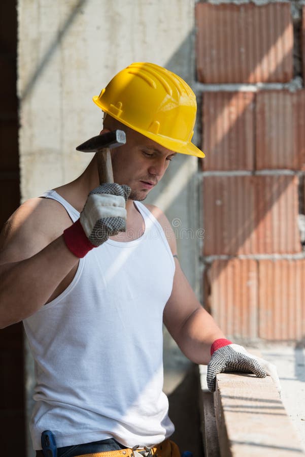 Construction Man Hitting Wood with Hammer Stock Photo - Image of ...