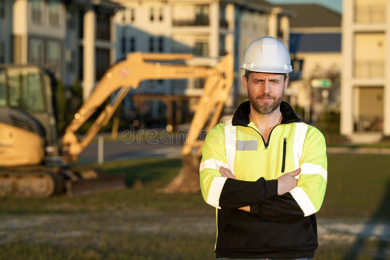 Construction Man Industry with Excavator at Industrial Site. Worker in ...