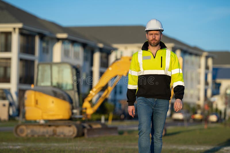 Construction Man Industry with Excavator at Industrial Site. Worker in ...