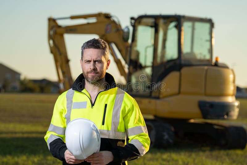 Construction Man Industry with Excavator at Industrial Site. Worker in ...