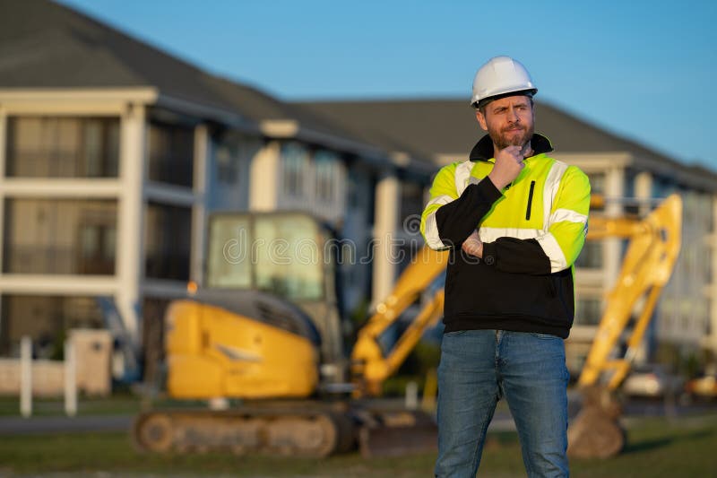 Construction Man Industry with Excavator at Industrial Site. Worker in ...