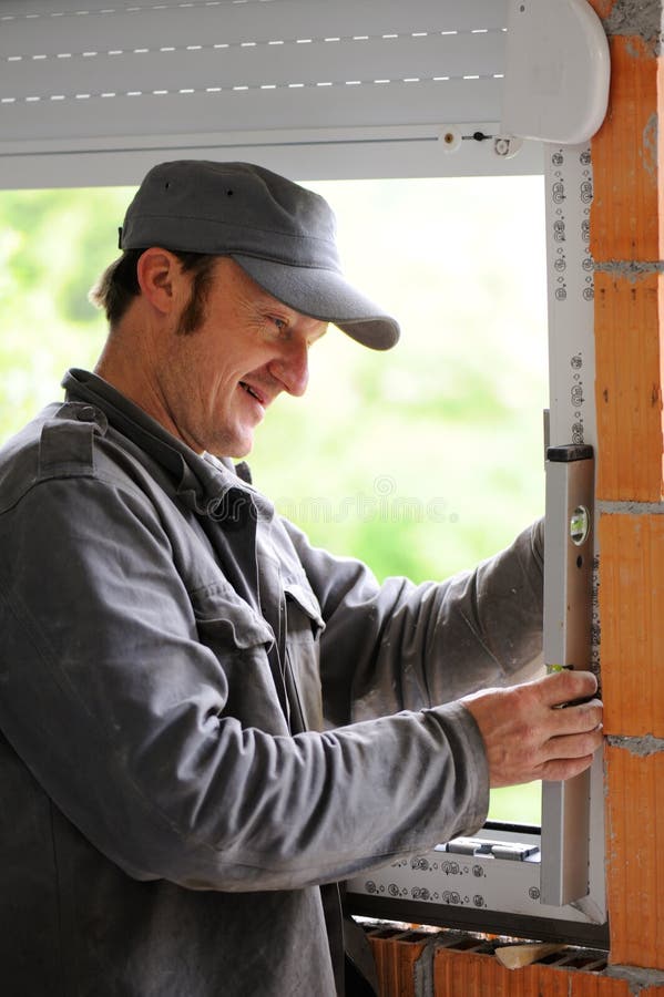 Construction Man Using Level Tool Stock Photo - Image of jeans, handy ...
