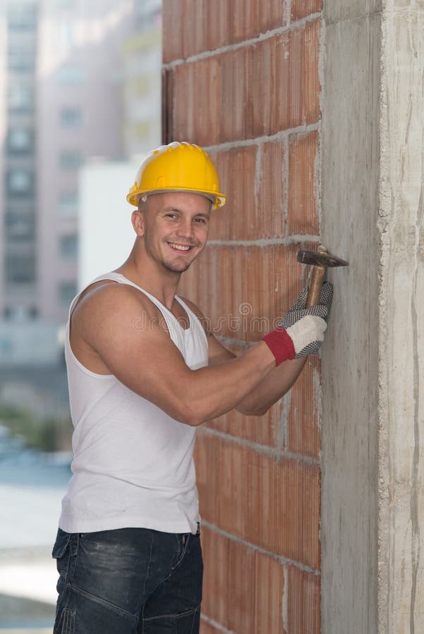 Construction Man Working with Hammer Stock Photo - Image of plumber ...