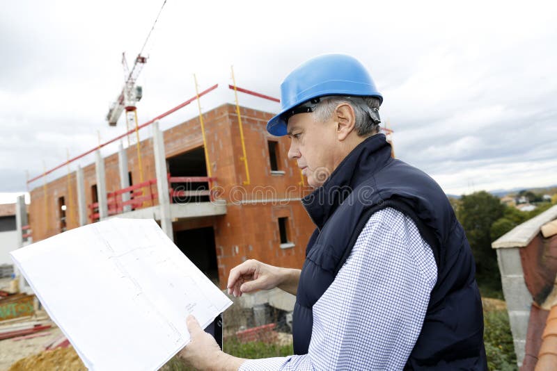 Construction Manager with Blueprint on Site Stock Image - Image of ...