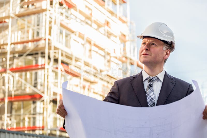 Construction Manager with Blueprints Stock Image - Image of engineering ...