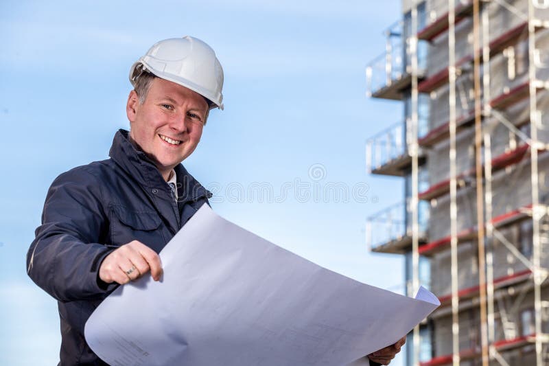 Construction Manager with Blueprints Stock Photo - Image of looking ...