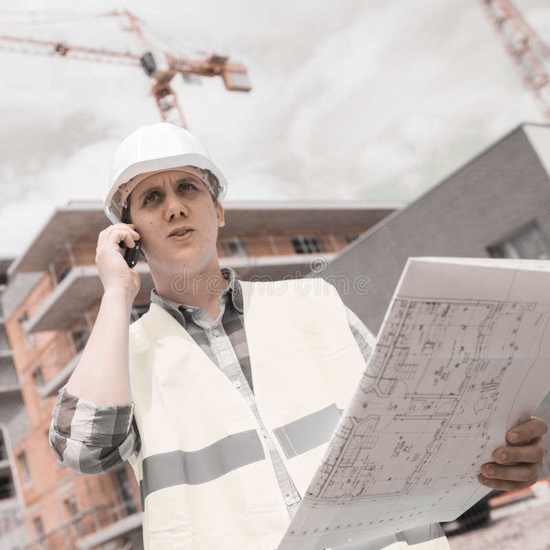 Construction Manager Checking Building Project on Site Stock Photo ...