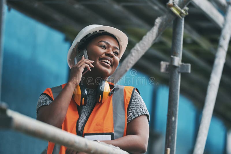Construction Manager, Contractor and Engineer Talking on a Phone while ...