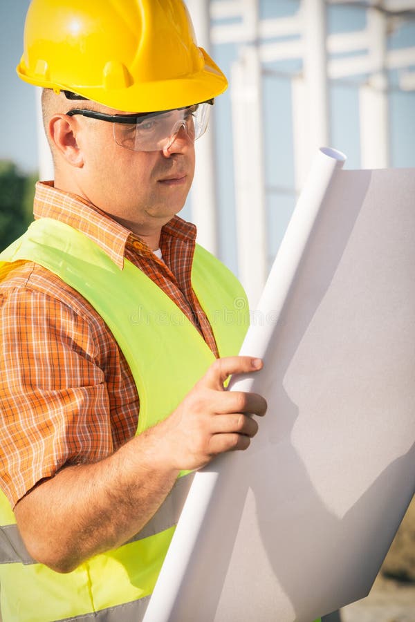 Construction Manager Controlling Building Site with Plan Stock Photo ...