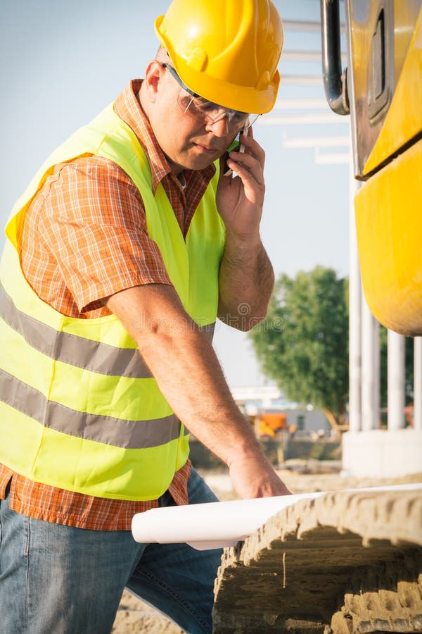 Construction Manager Controlling Building Site with Plan Stock Photo ...