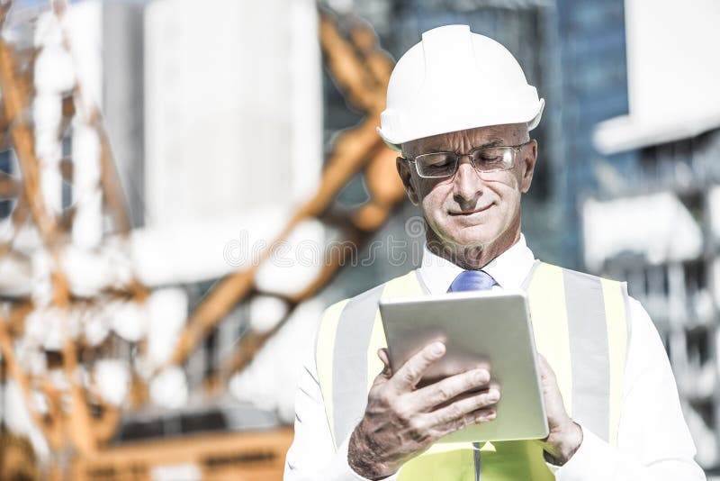 Construction Manager Controlling Building Site and Tablet Device Stock ...