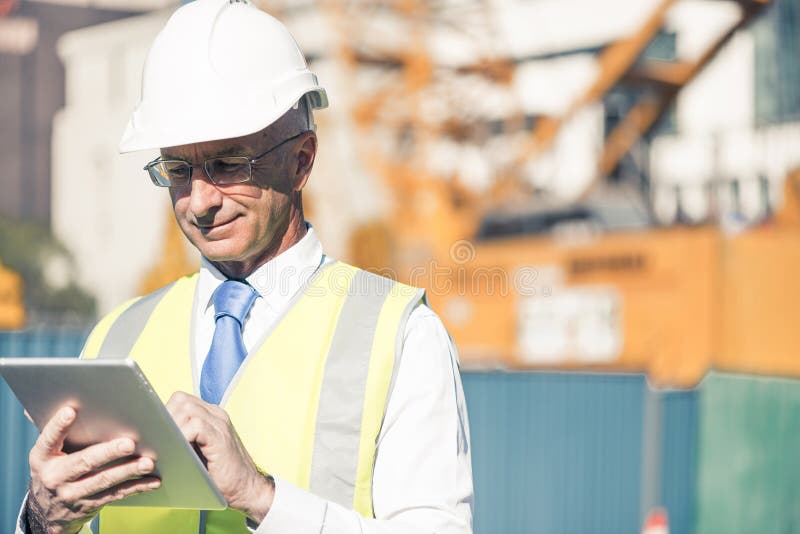 Construction Manager Controlling Building Site and Tablet Device Stock ...