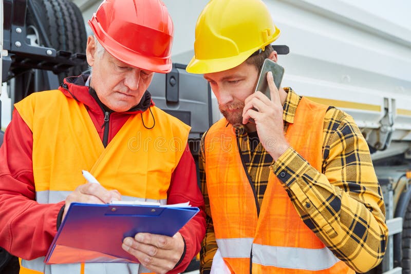 Construction Manager and Foreman with Checklist and Smartphone Stock ...