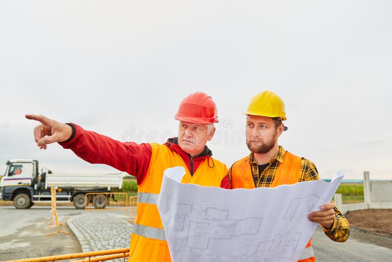 Construction Manager or Architect with Floor Plan or Site Plan Stock ...