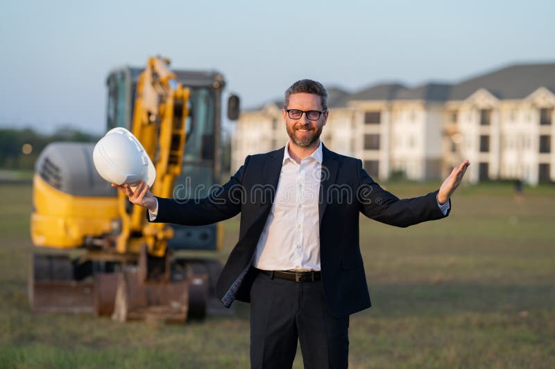 Construction Manager in Suit and Helmet at a Construction Site ...