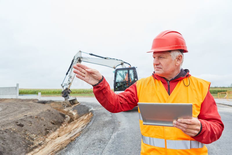 Construction Manager with Tablet Computer during Construction Planning ...