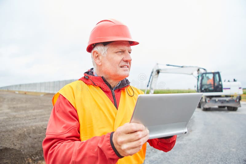 Construction Manager with Tablet PC on the Construction Site in Road ...