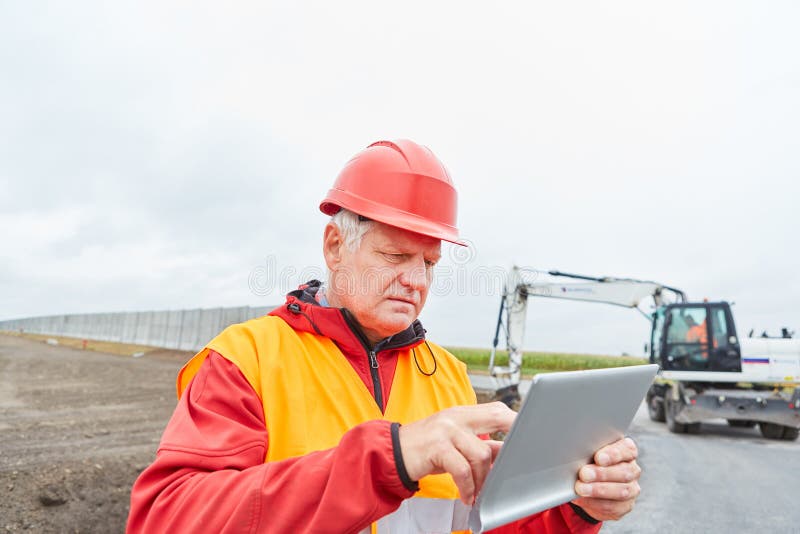 Construction Manager Using Tablet Computer on Construction Site Stock ...
